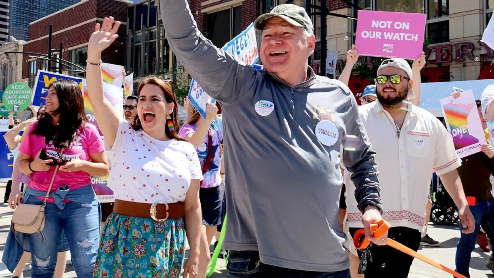 tim-walz-marching-lgbtq-pride-parade - OUT FRONT